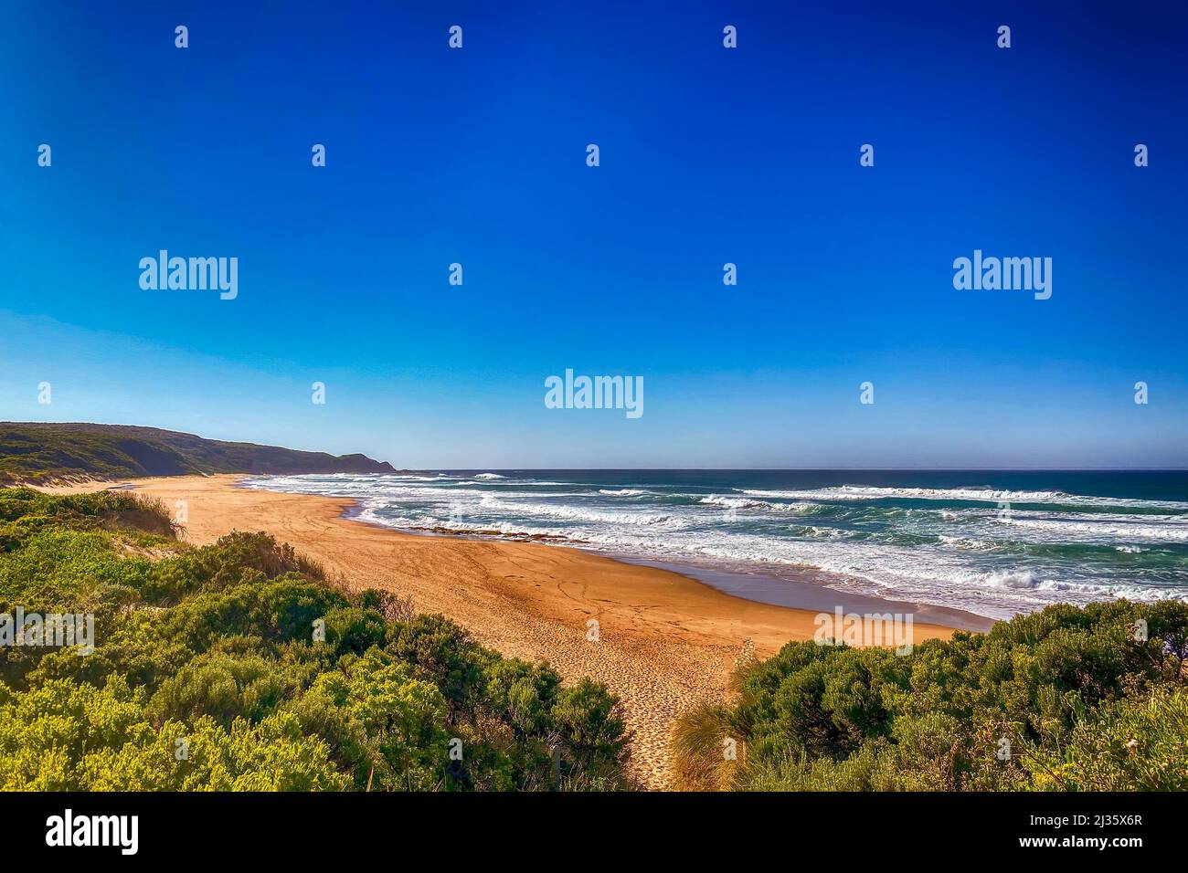 Strong waves rolling rocky beach hi-res stock photography and images ...