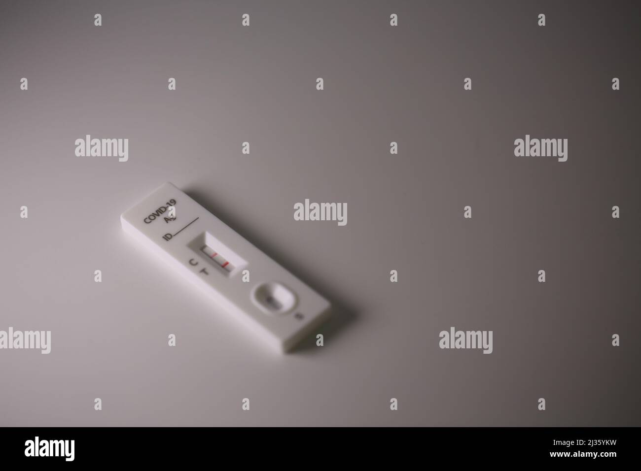 quick antigen test with positive antigen in the low light background ...