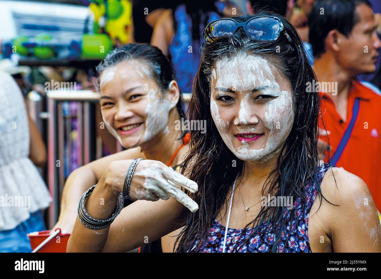 Bangkok, Thailand, April 13th, 2013. Thai women wearing powder enjoy ...