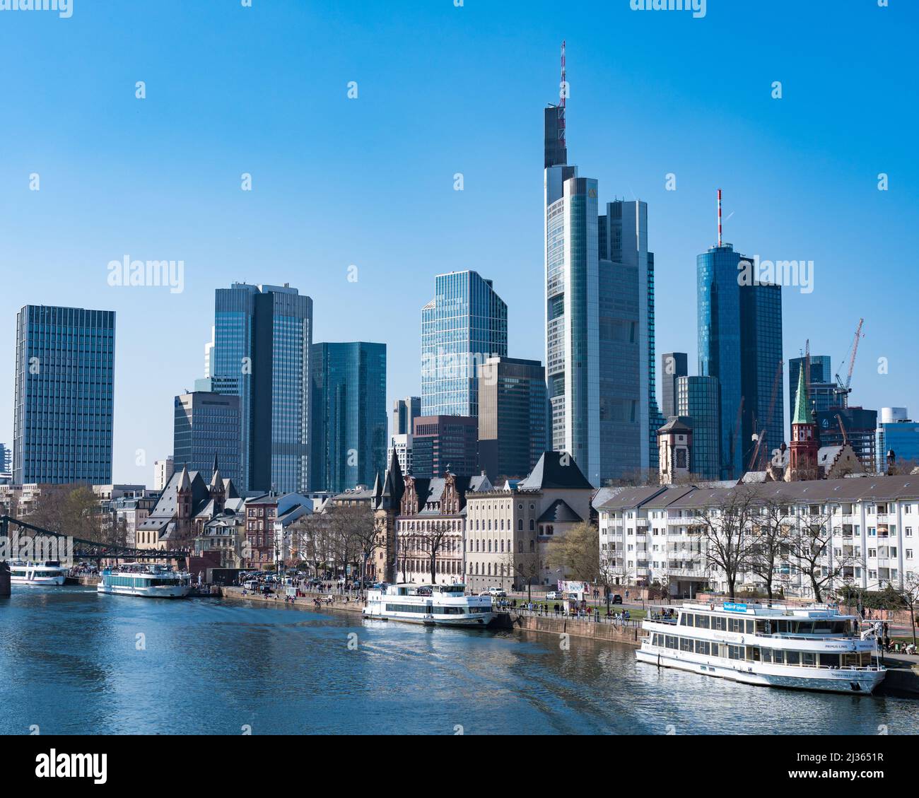 An urban view of riverside modern skyscrapers in springtime on a sunny ...