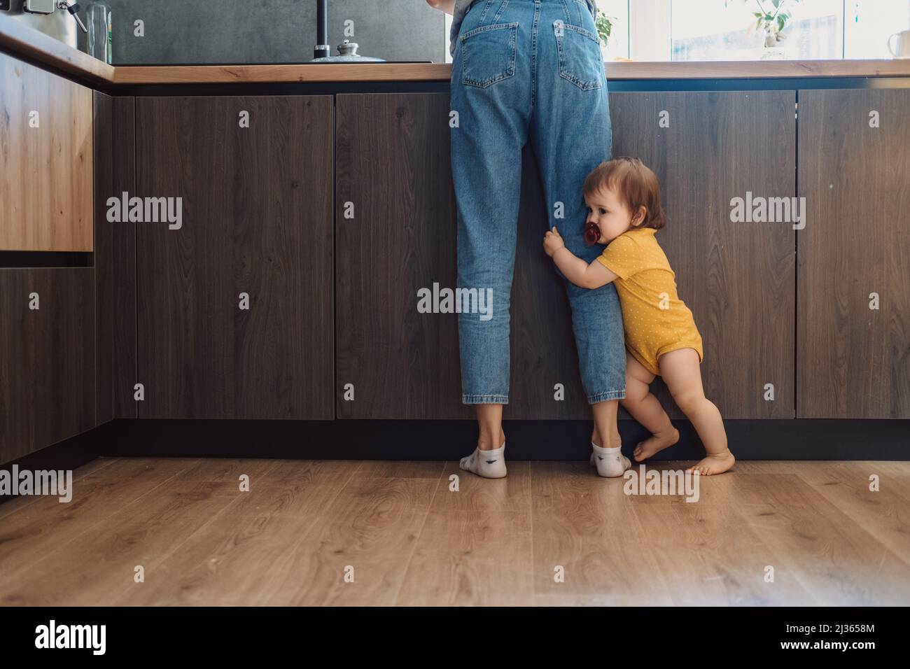 Child holding mom leg hi-res stock photography and images - Alamy