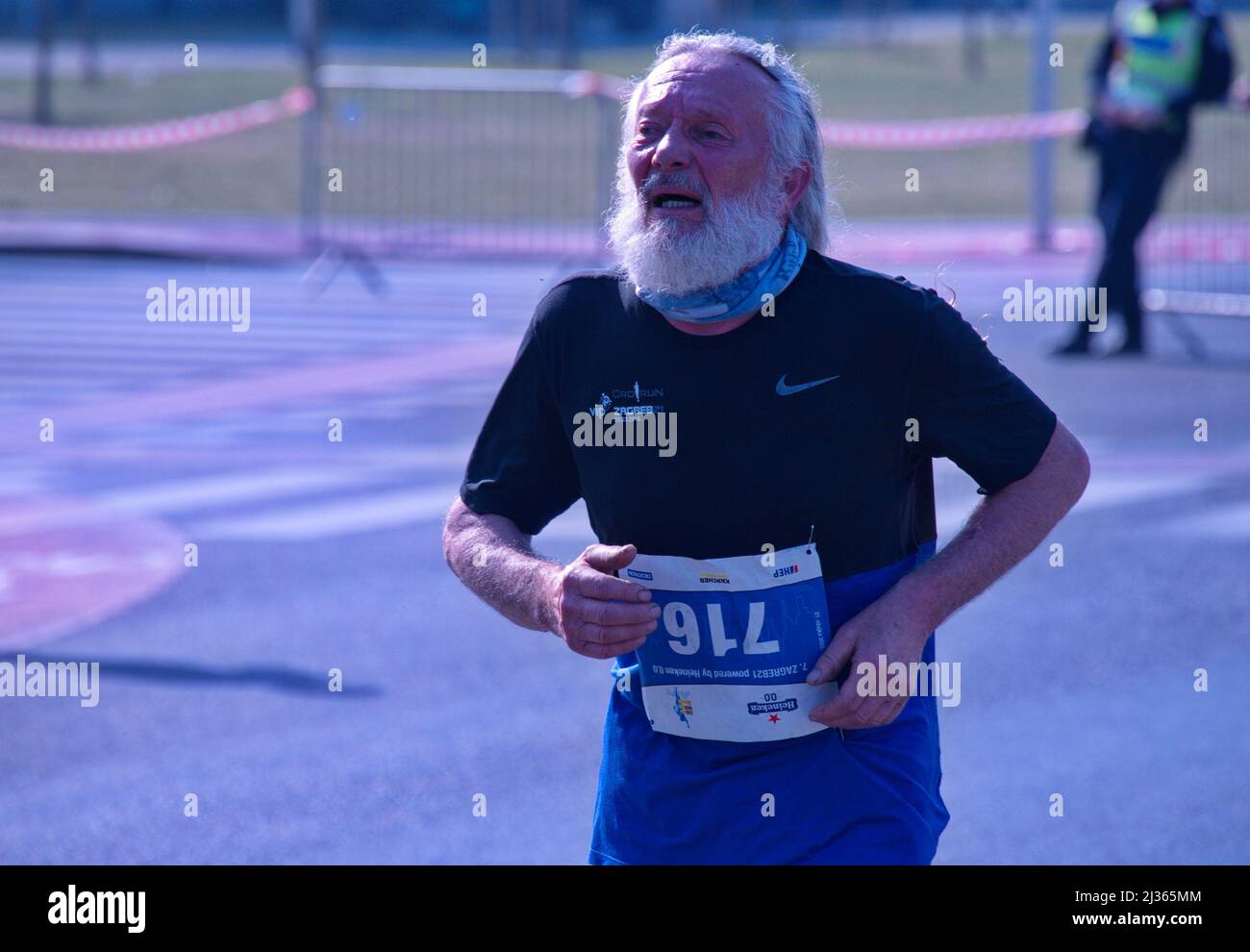 Active senior man running marathon Stock Photo - Alamy