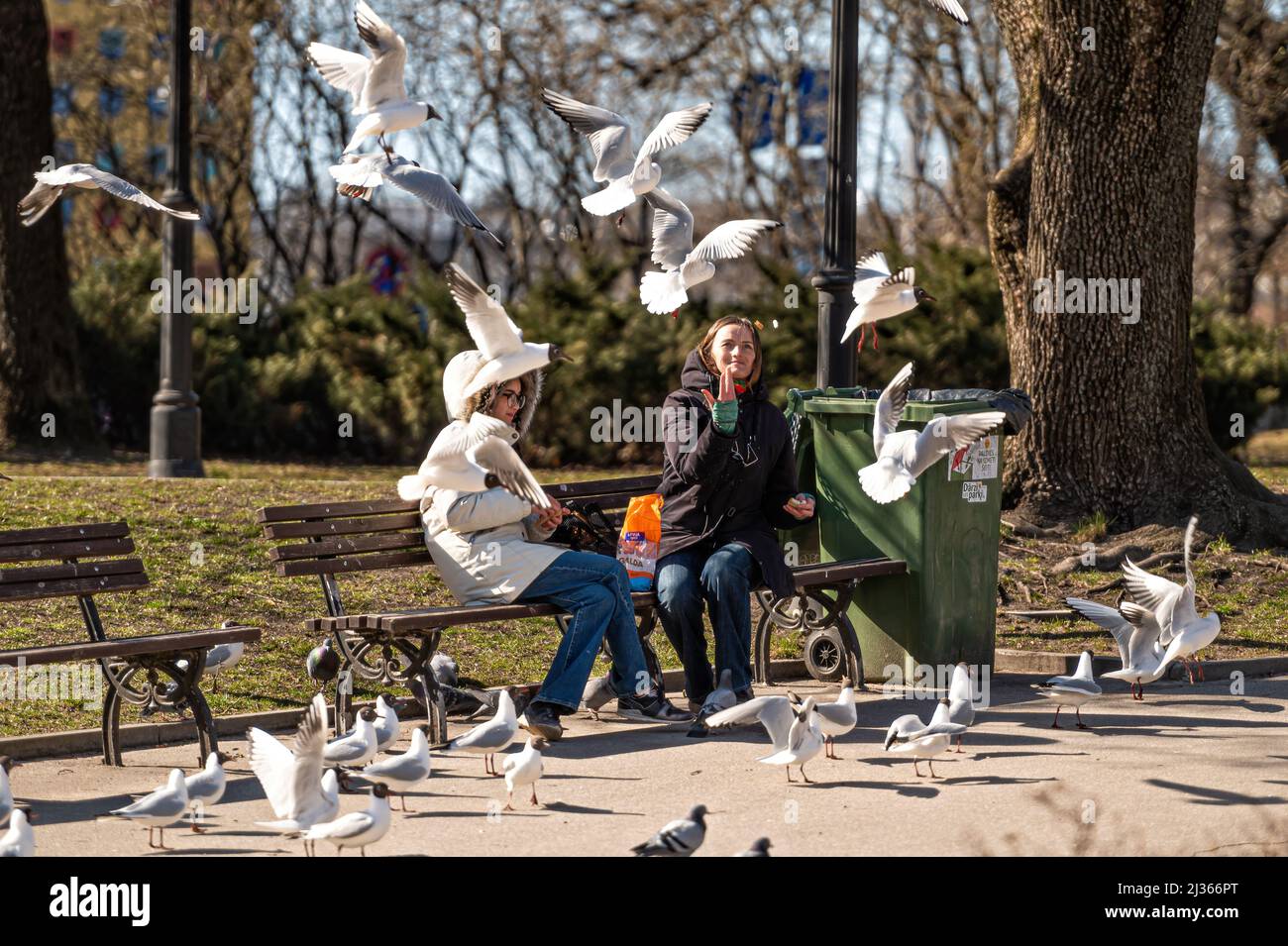 Riga, Latvia - April 2, 2022: People enjoy the first warm days of ...