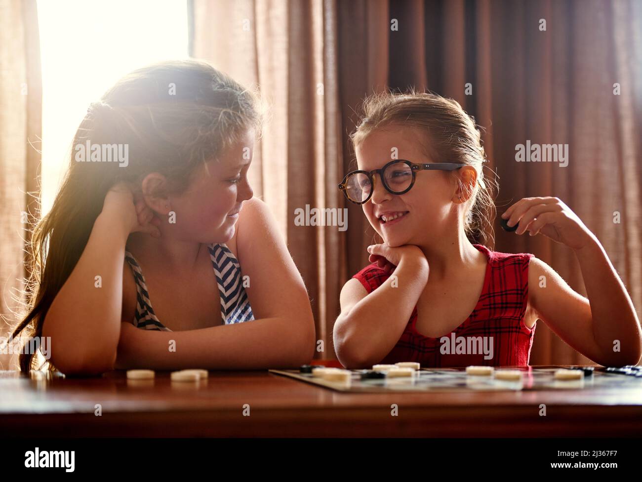 Two girls playing board game hi-res stock photography and images - Alamy