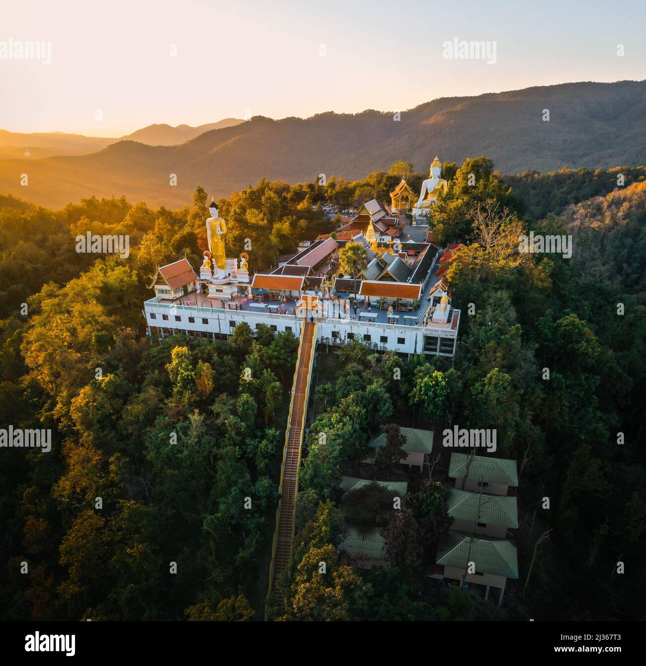 Aerial view of Wat Phrathat Doi Kham, Buddha pagoda and golden chedi in ...