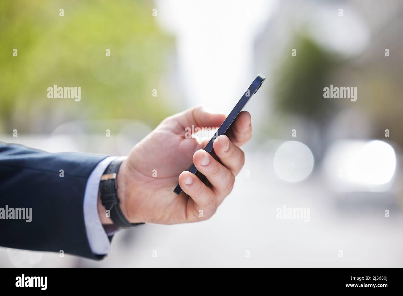 Step aside. Cropped shot of an unrecognizable businessman using his ...