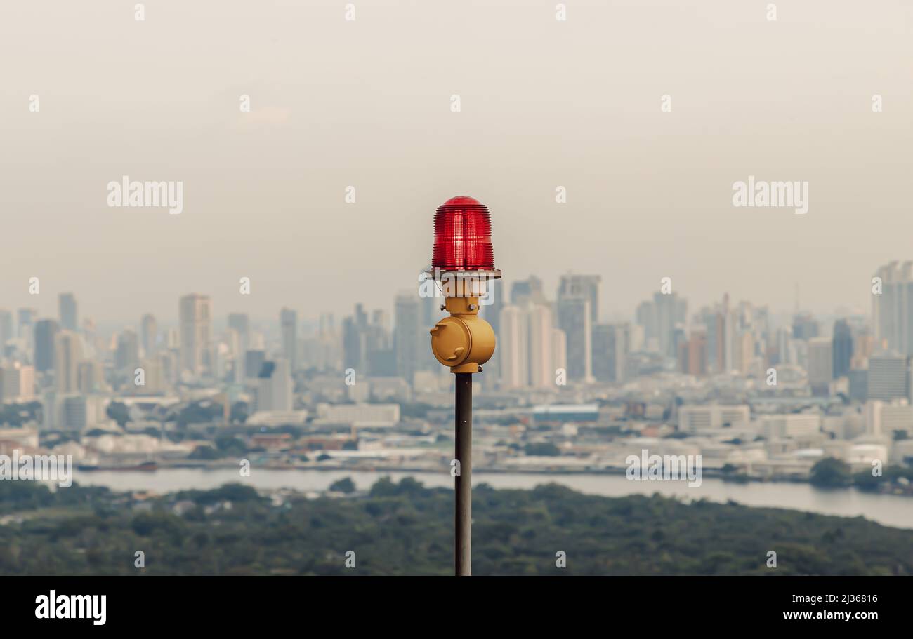 Red lantern of obstruction lights mounted on the rooftop of high rise ...