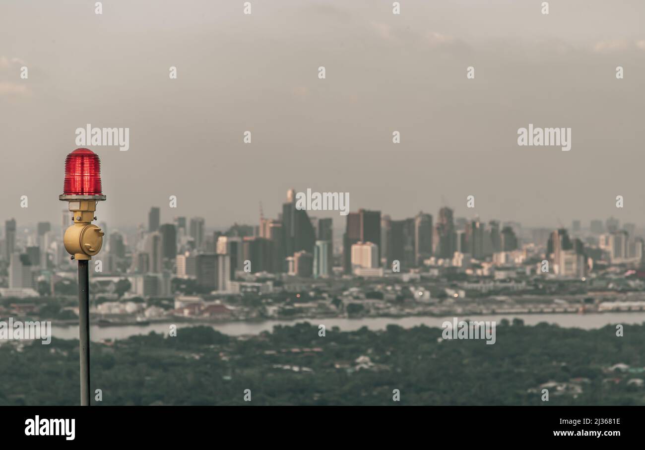 Red lantern of obstruction lights mounted on the rooftop of high rise ...