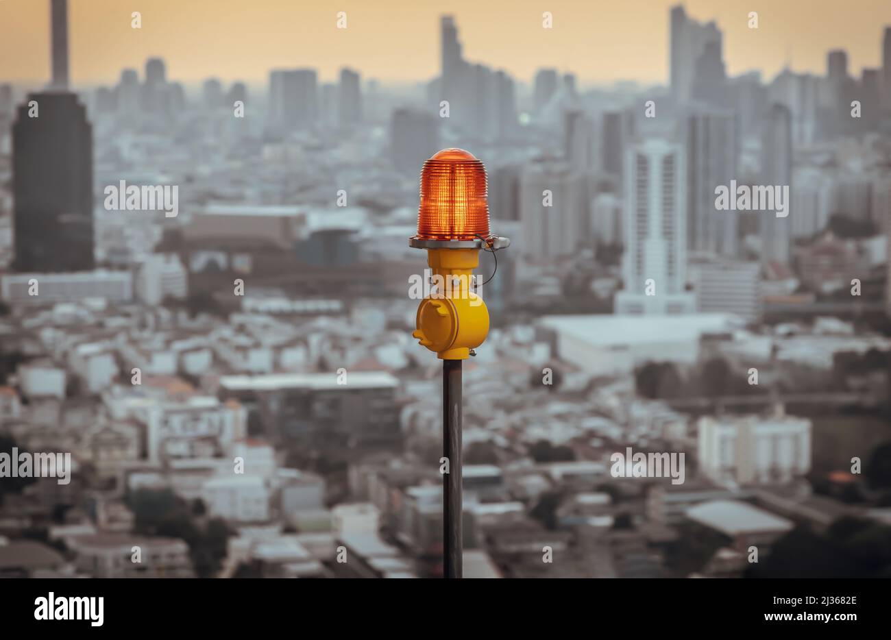 Red lantern of obstruction lights mounted on the rooftop of high rise ...