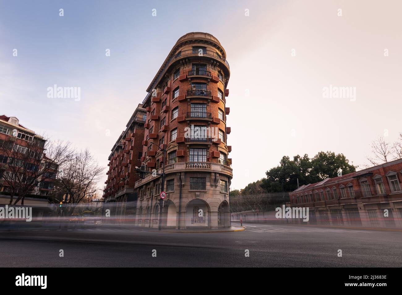 Wukang building in Shanghai in long exposure with passing traffic Stock ...