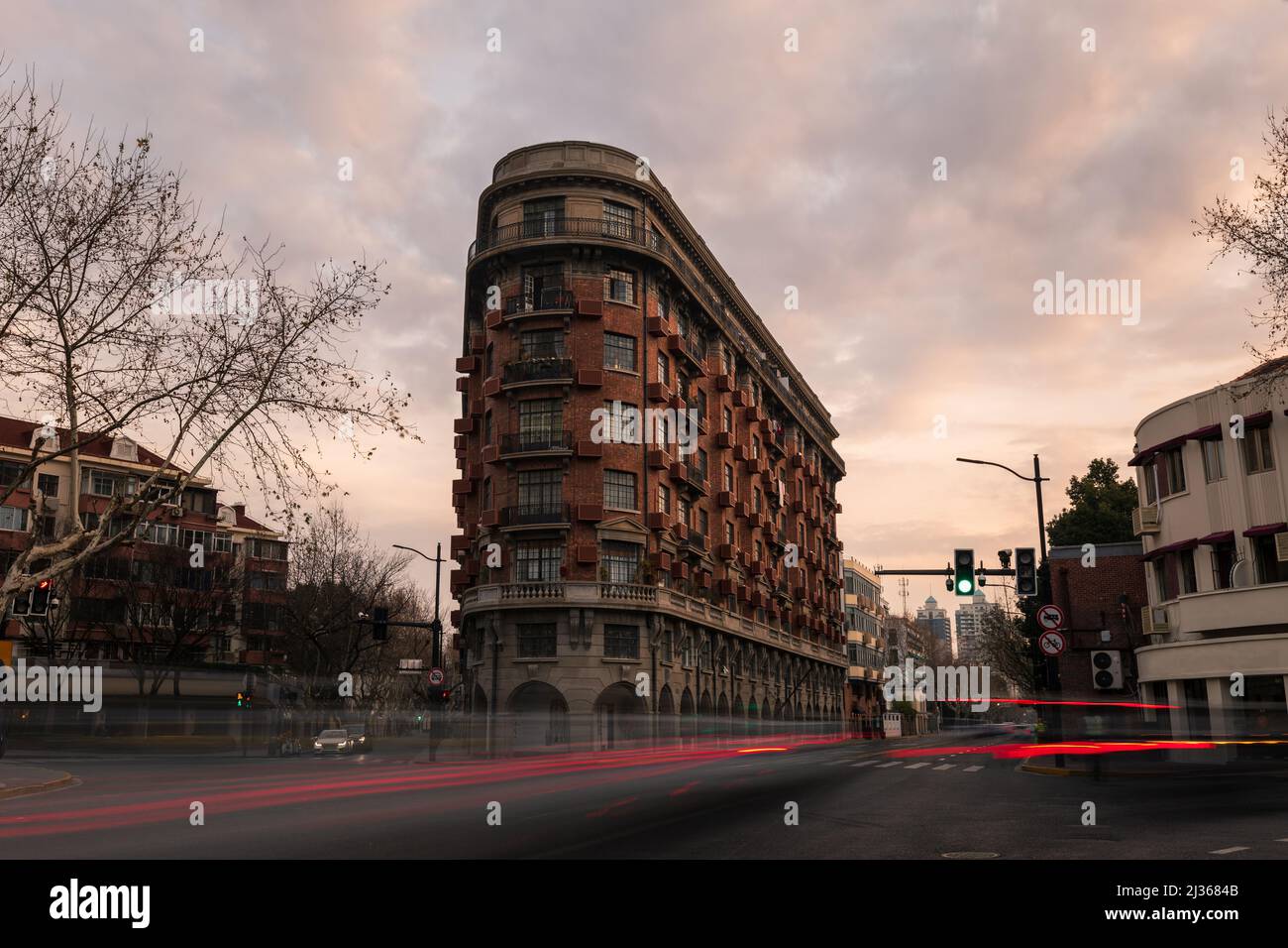 Wukang building in Shanghai in long exposure with passing traffic Stock ...
