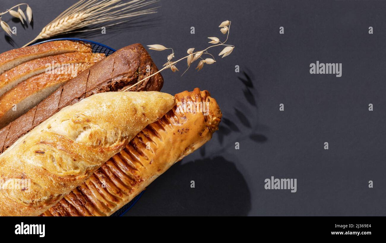 Homemade natural breads. Fresh loafs of bread in the blue basket with ...