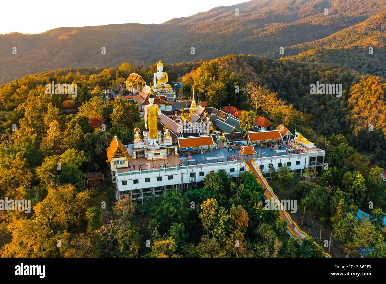 Aerial view of Wat Phrathat Doi Kham, Buddha pagoda and golden chedi in ...