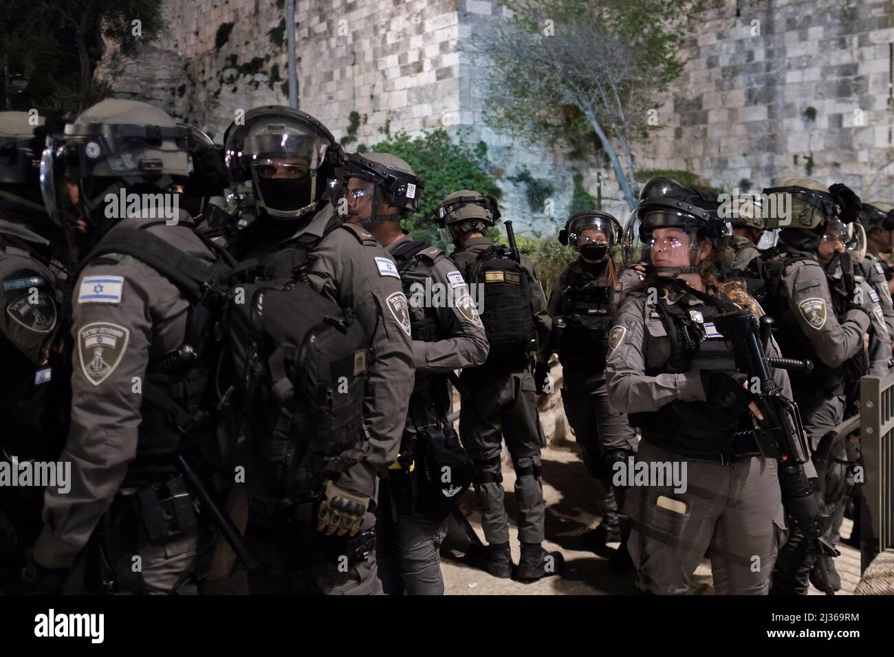Members of the Israeli security forces stand guard on the fourth day of ...