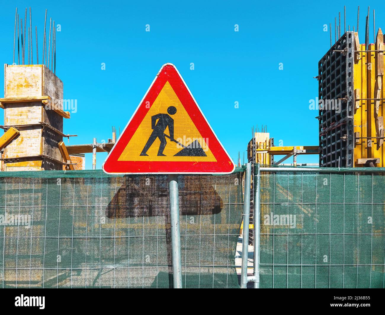 Road work traffic sign on construction site, A men at work warning signage Stock Photo - Alamy