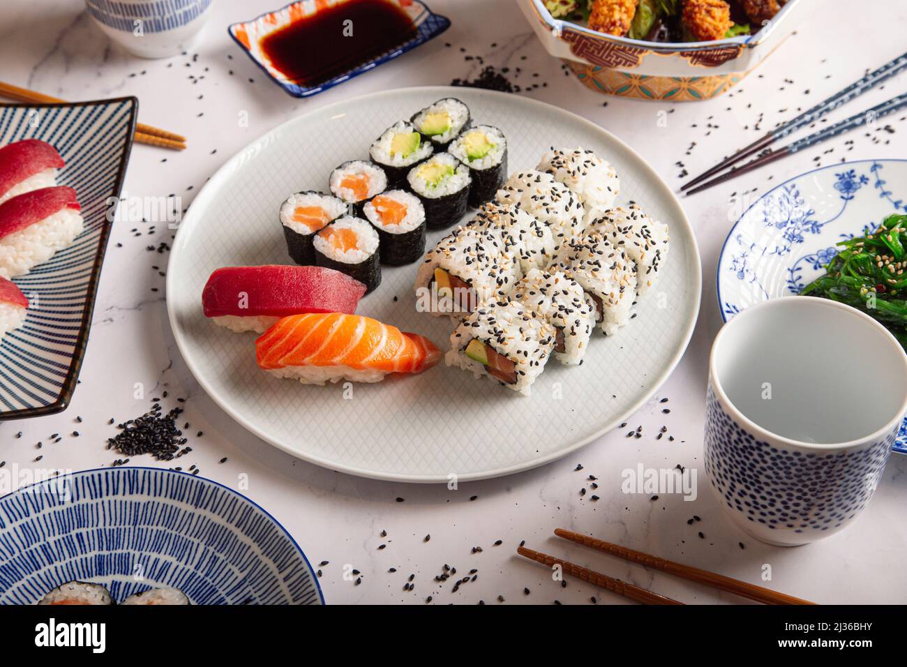 Varied sushi menu at the restaurant table Stock Photo - Alamy