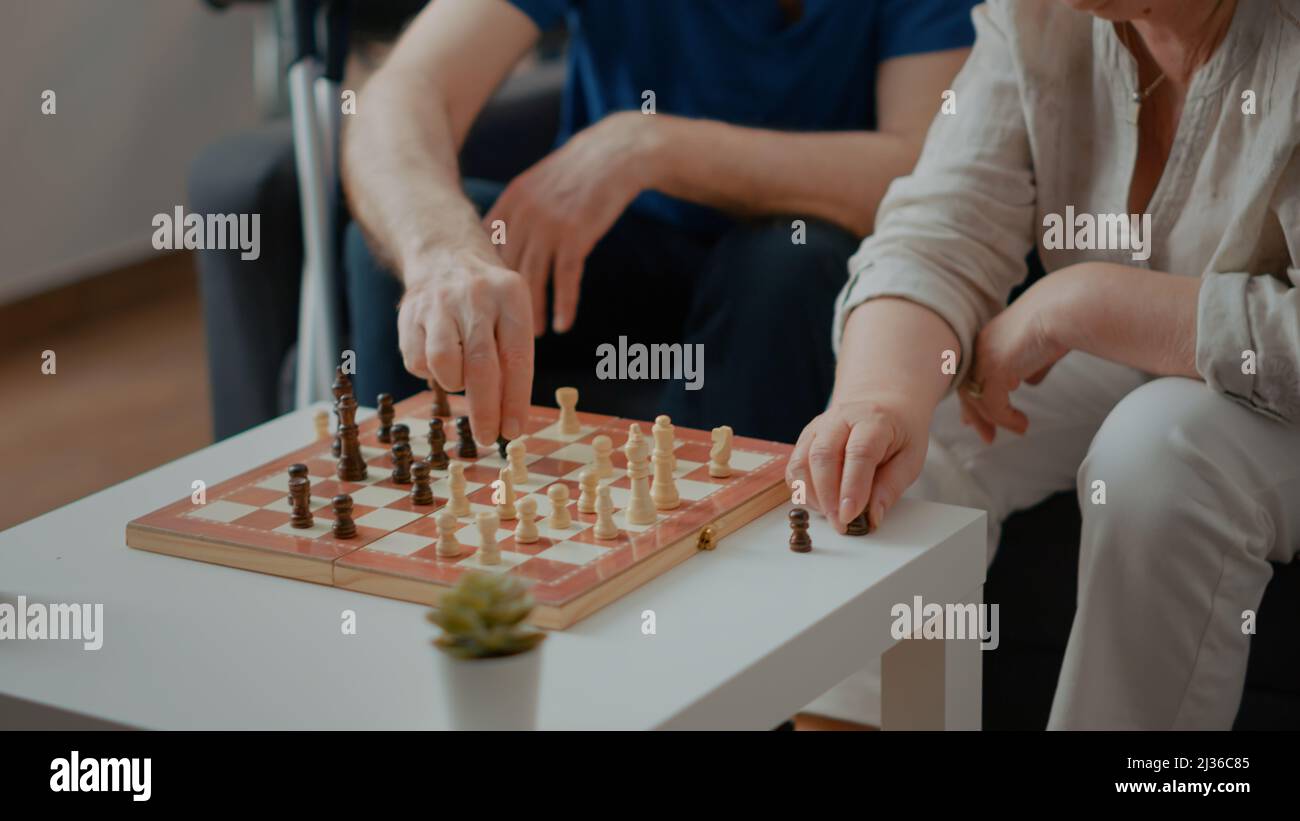 Intellectual people playing chess game with pieces and board, enjoying ...