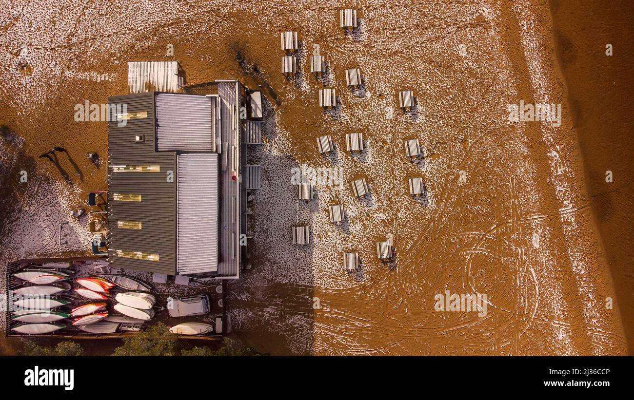 Loch Morlich beach in the Scottish highlands is snowfell, in aerial ...