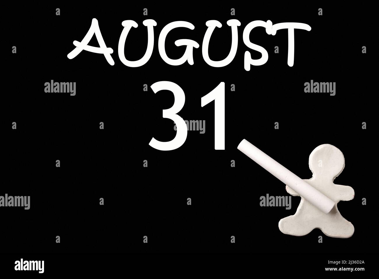 31st day of August. A small white plasticine man writing the date 31 ...
