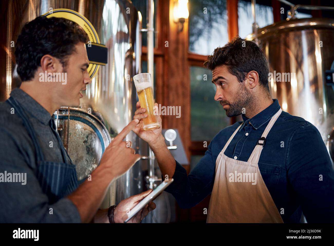 The color of the beer also says a lot about it. Shot of two focused ...