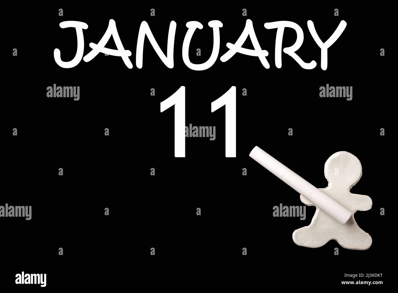 11th day of January. A small white plasticine man writing the date 11 ...