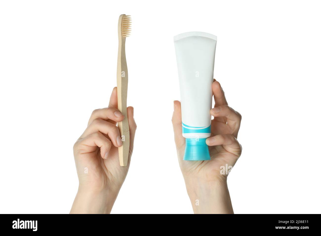 Female hands hold toothpaste and toothbrush, isolated on white ...