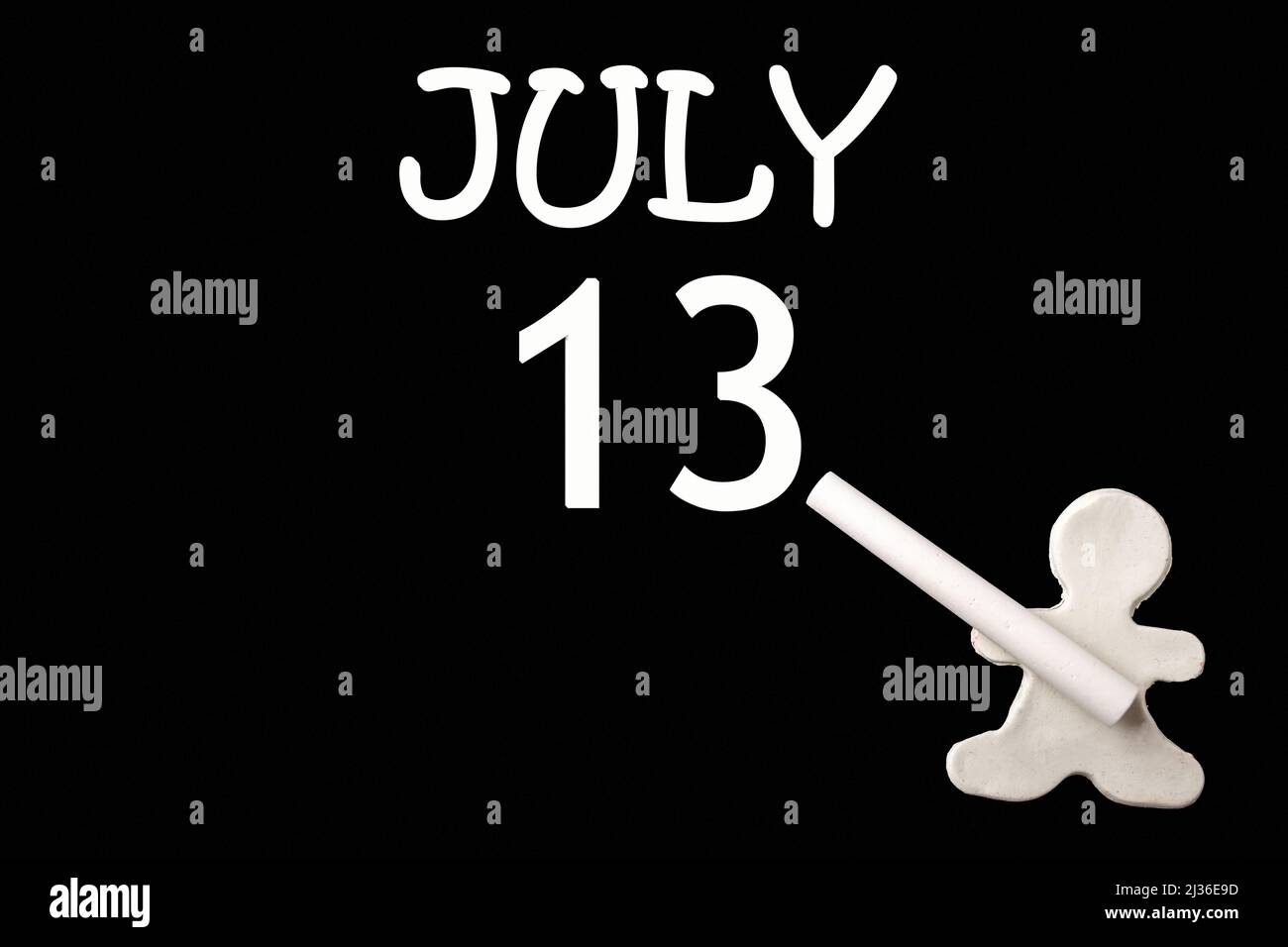 13th day ofJuly. A small white plasticine man writing the date 13July ...