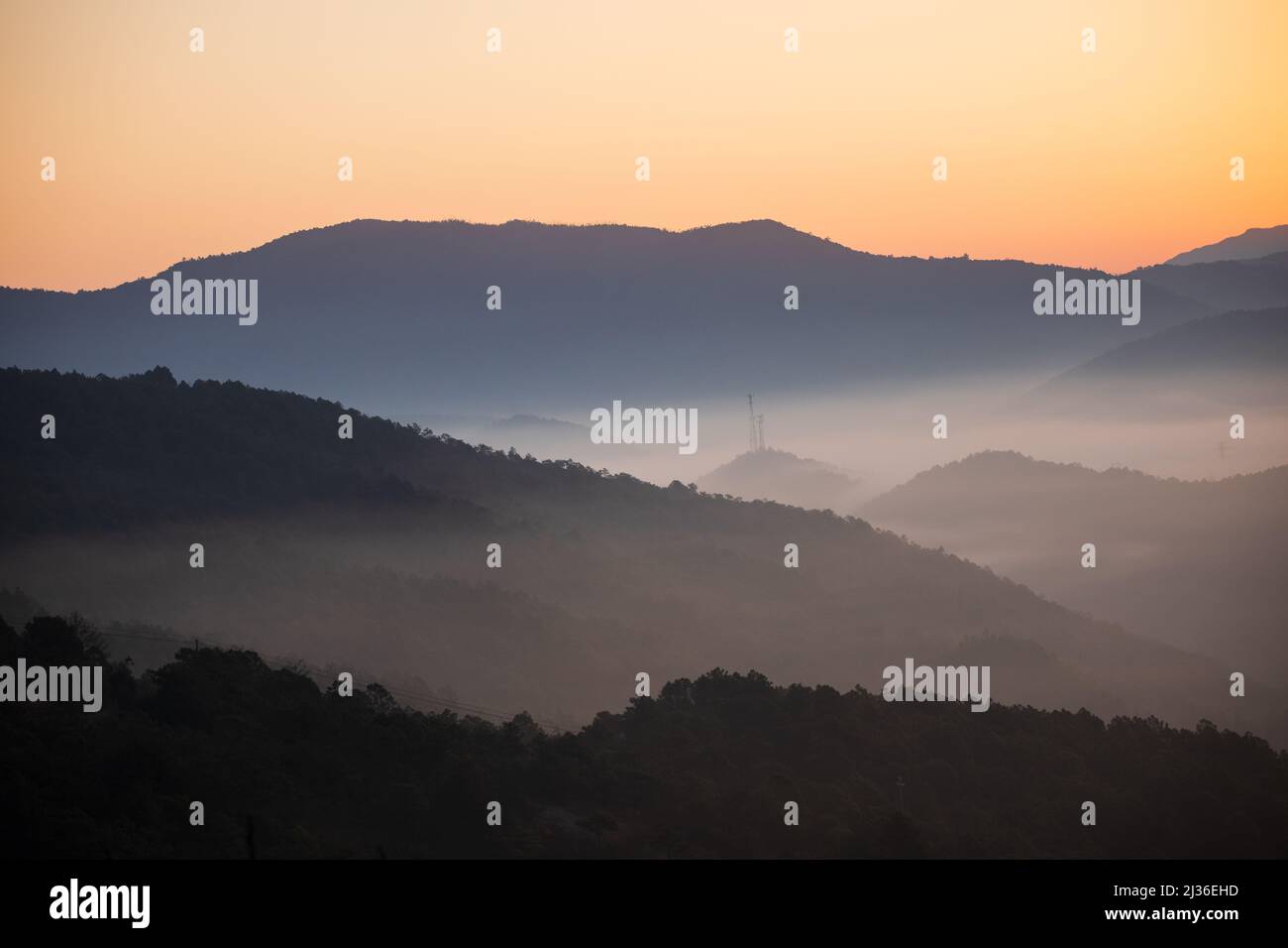 Beautiful sunrise in foggy mountains hi-res stock photography and ...
