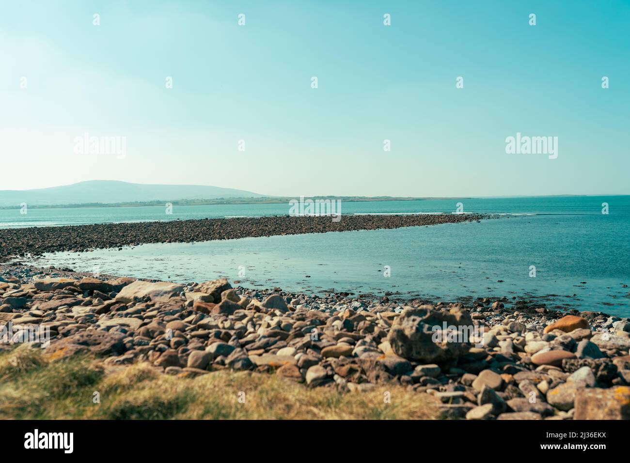 The ocean surrounded by rocks in Strandhill, Ireland Stock Photo - Alamy