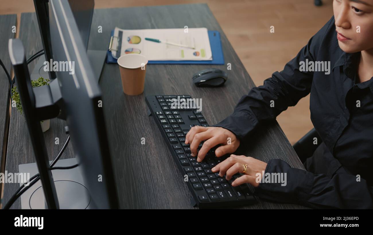 Focus On Programer Hands Typing Code On Keyboard While Looking At
