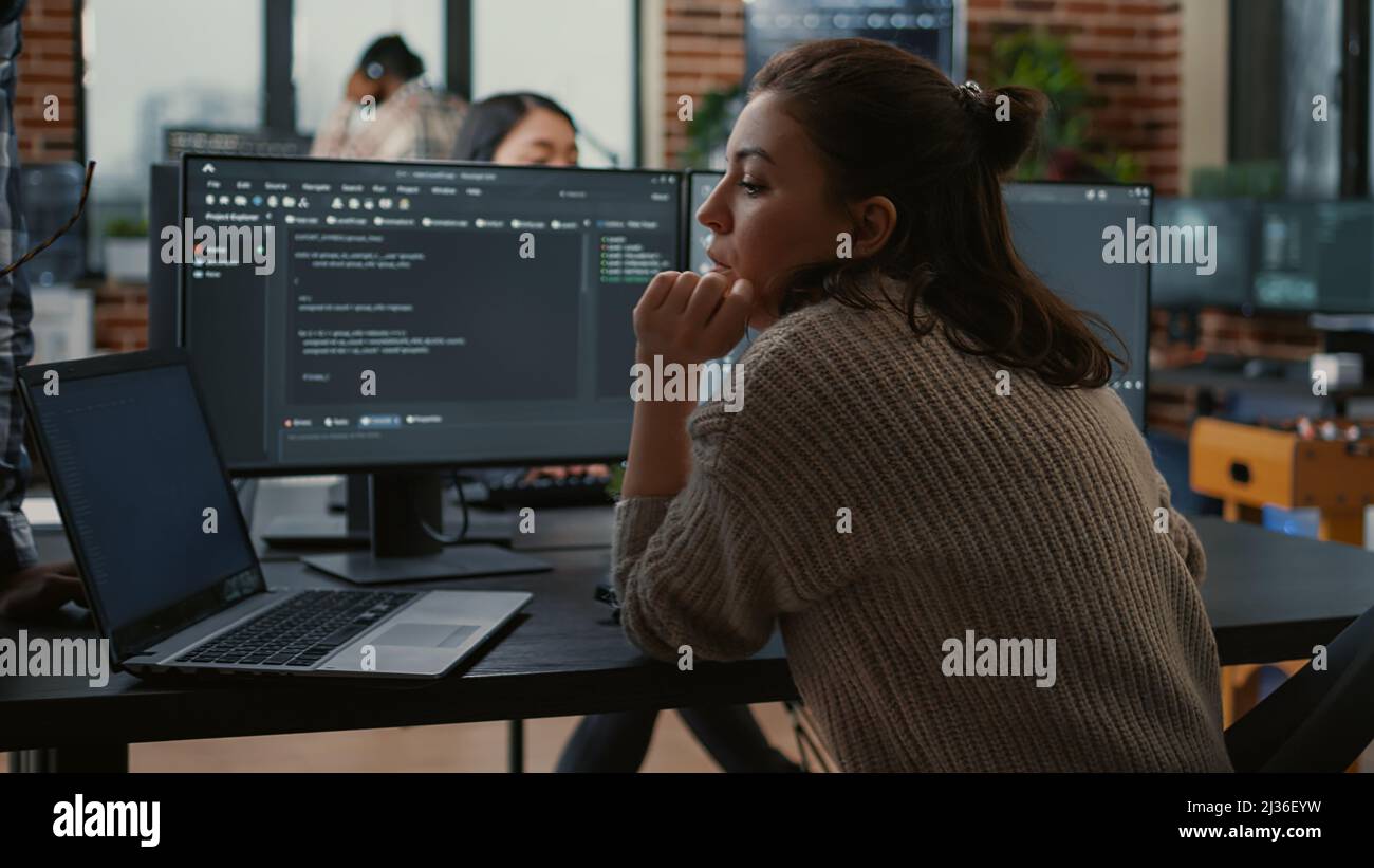 Junior developer putting laptop with source code on senior dev desk ... Junior developer putting laptop with source code on senior dev desk ...