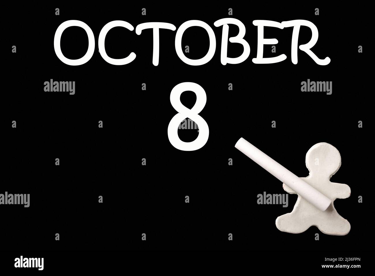 8th day of October. A small white plasticine man writing the date 8 ...