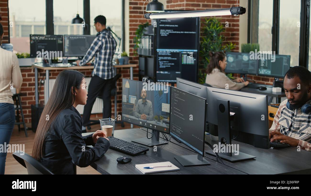 Software company employee in video call conference with business owner ...