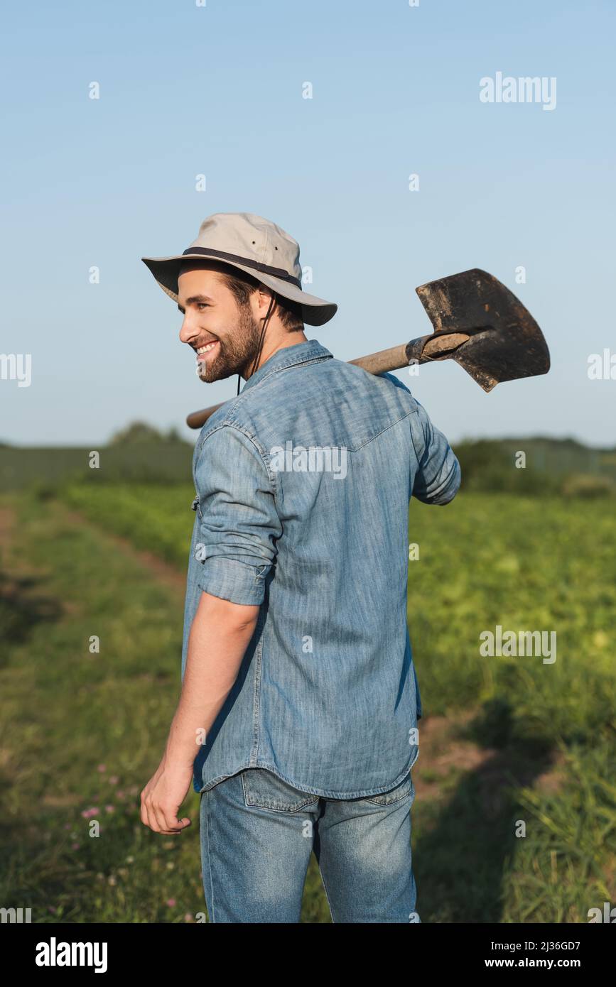 Back view cheerful farmer hi-res stock photography and images - Alamy