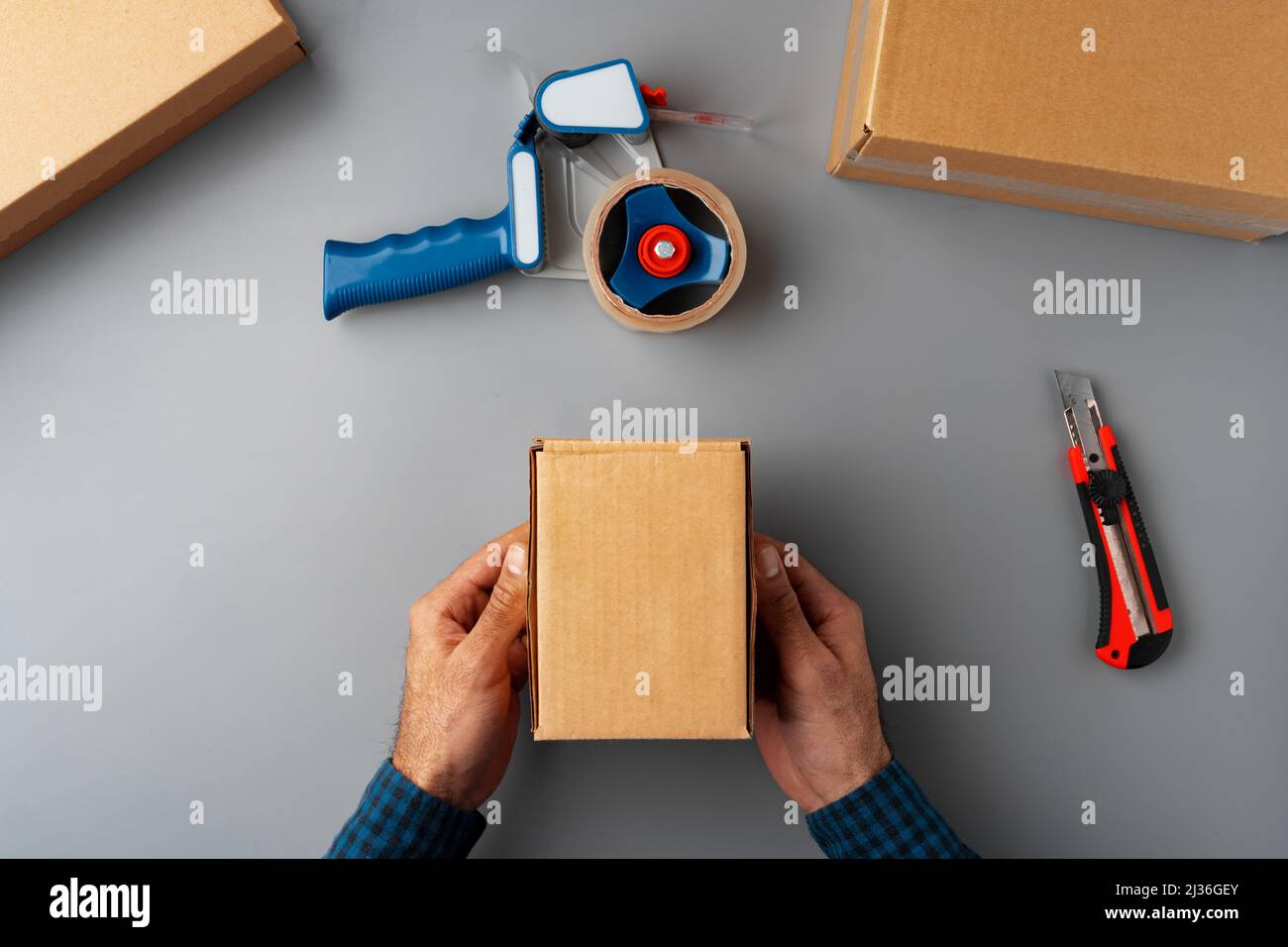 Above table top view of warehouse preparing post courier delivery ...