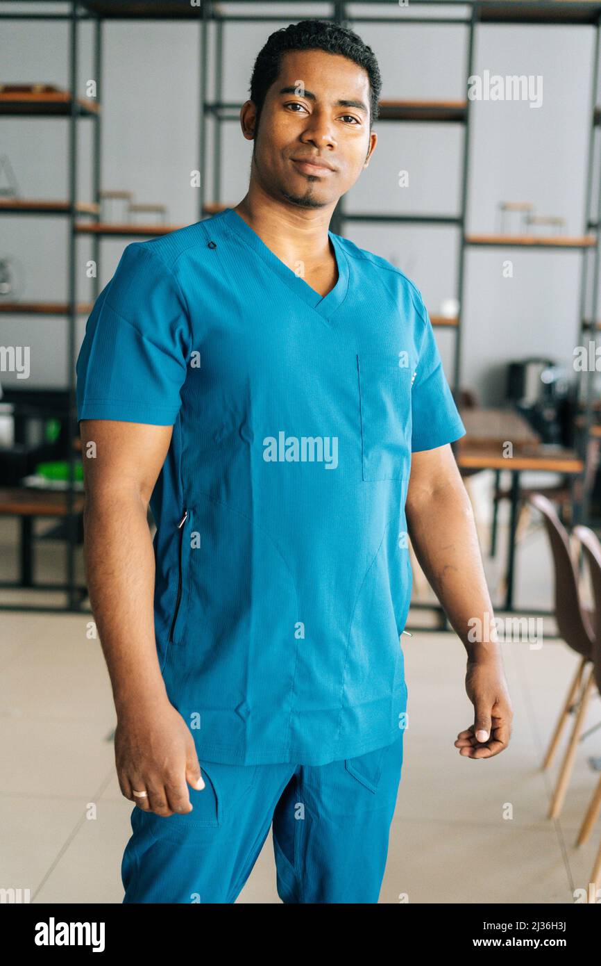 Vertical medium shot portrait of serious African American male doctor ...