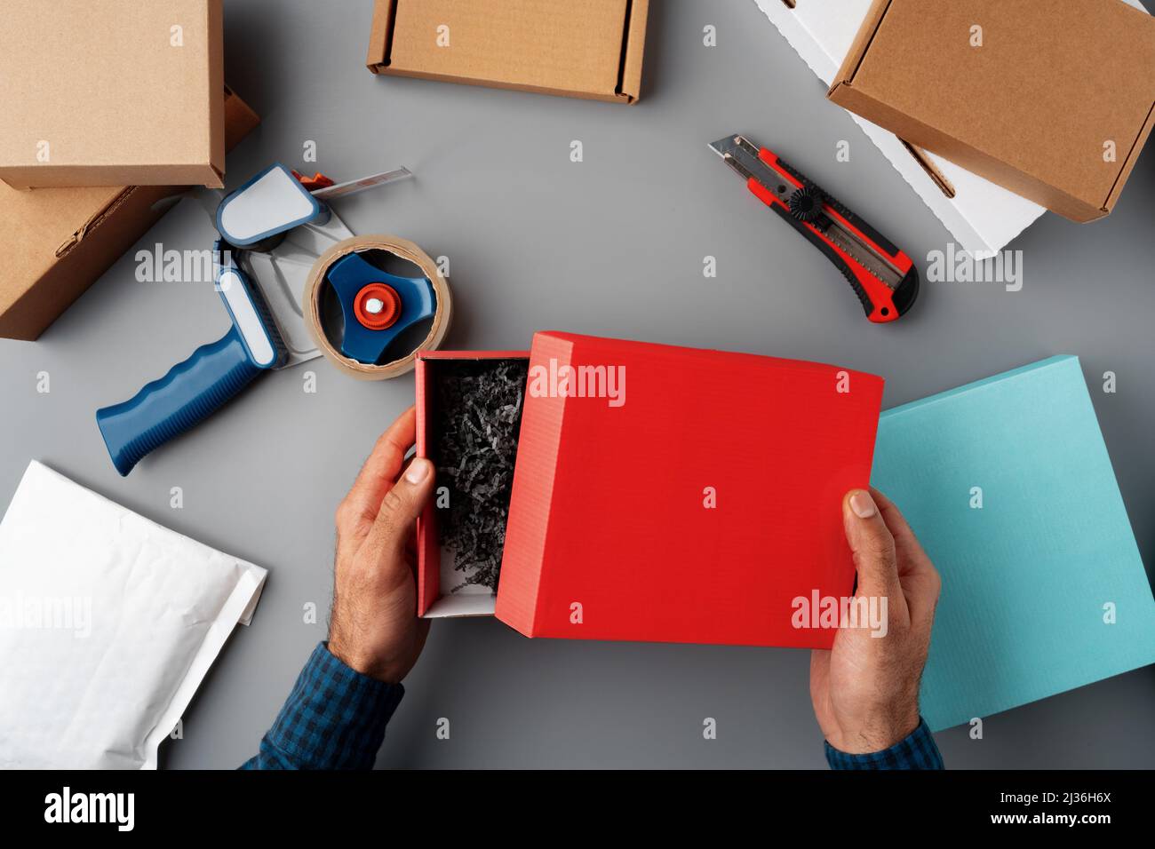 Above table top view of warehouse preparing post courier delivery ...