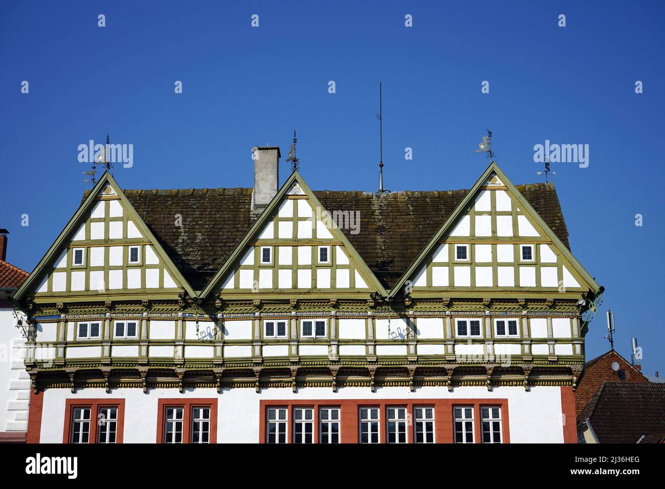 A frontal shot of residential buildings with tall roofs Stock Photo - Alamy