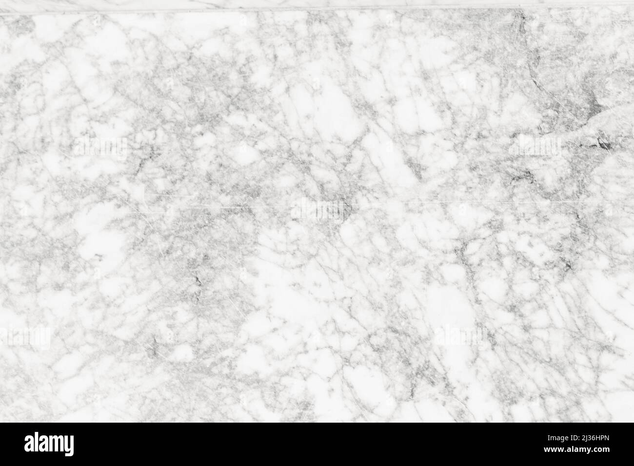 The texture of natural white marble made of natural tiles is a ...