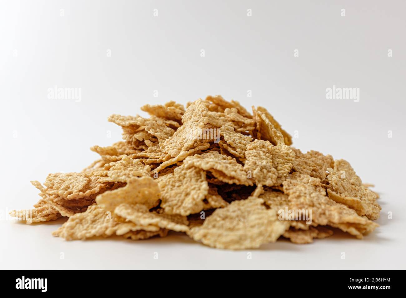 Brown rice cereal on a white background Stock Photo - Alamy