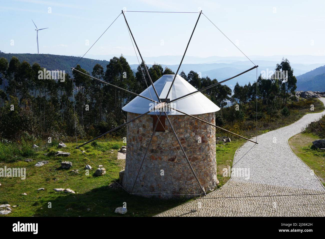 Rustic windmill on top of mountain Stock Photo - Alamy