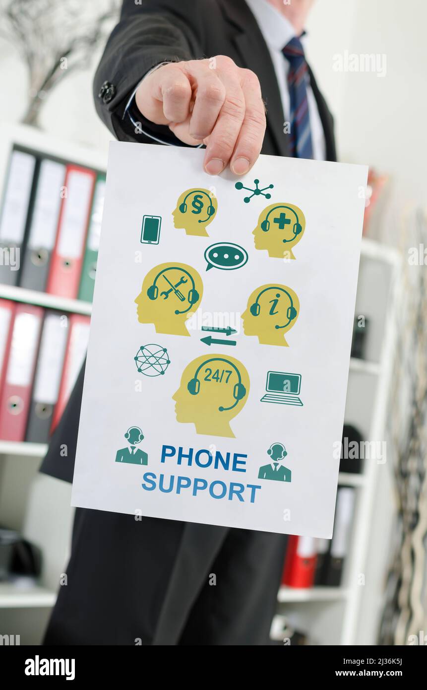 Paper showing phone support concept held by a businessman Stock Photo ...
