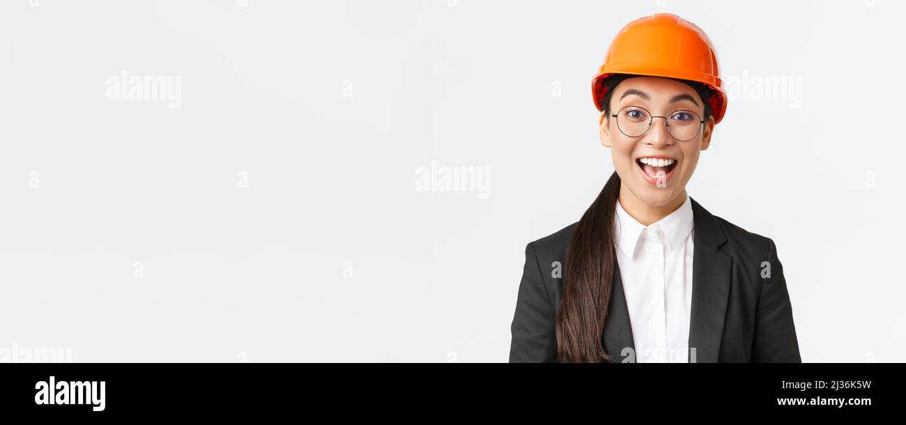 Close-up of excited upbeat asian female chief construction engineer ...