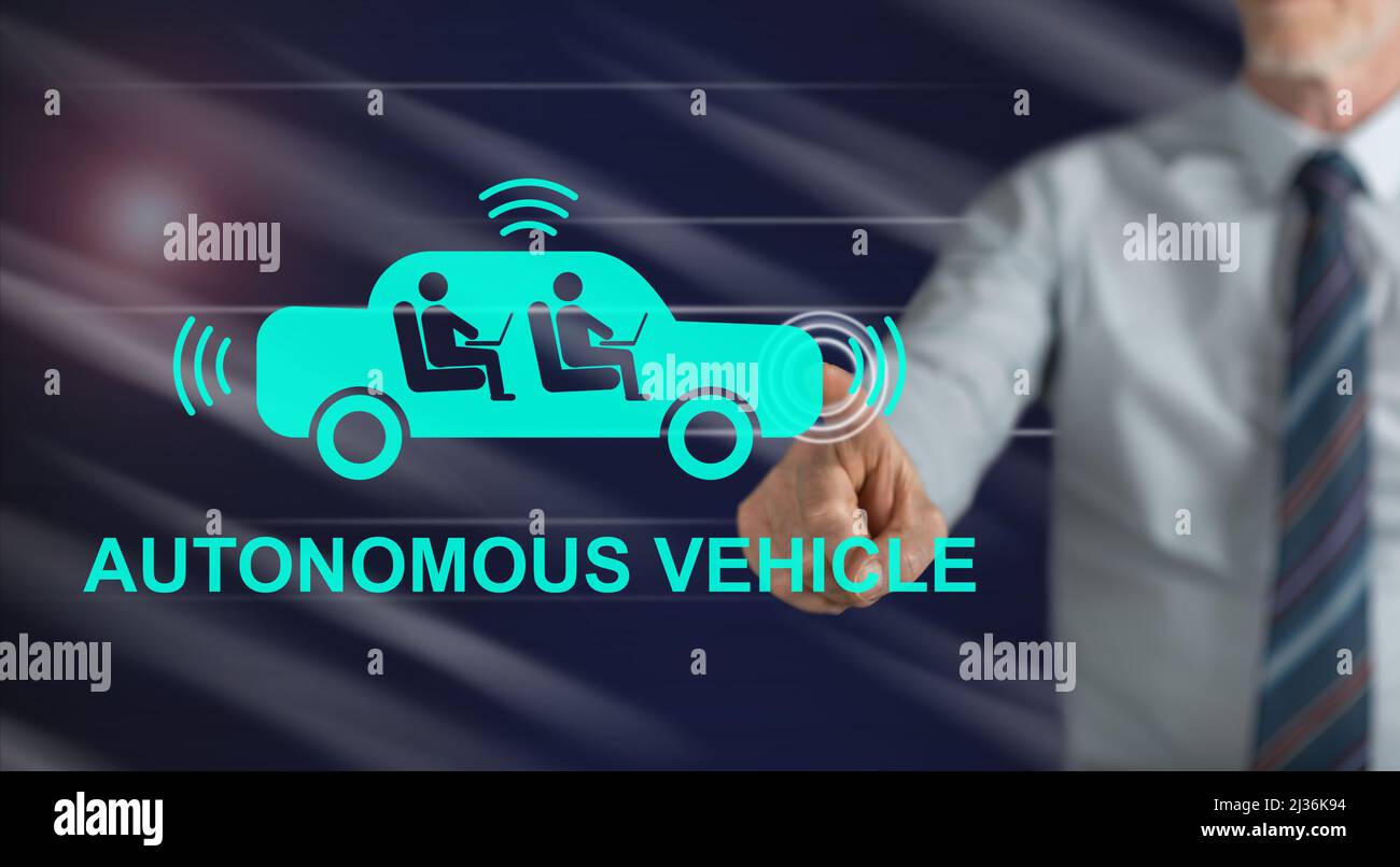 Man touching an autonomous vehicle concept on a touch screen with his ...