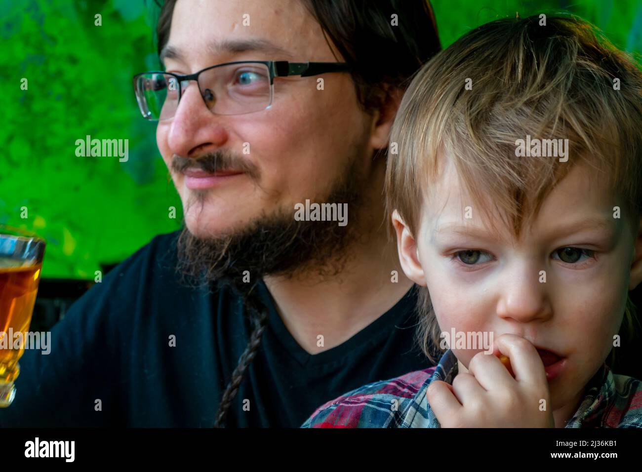 morning family happiness concept. Father and son are drinking tea in ...