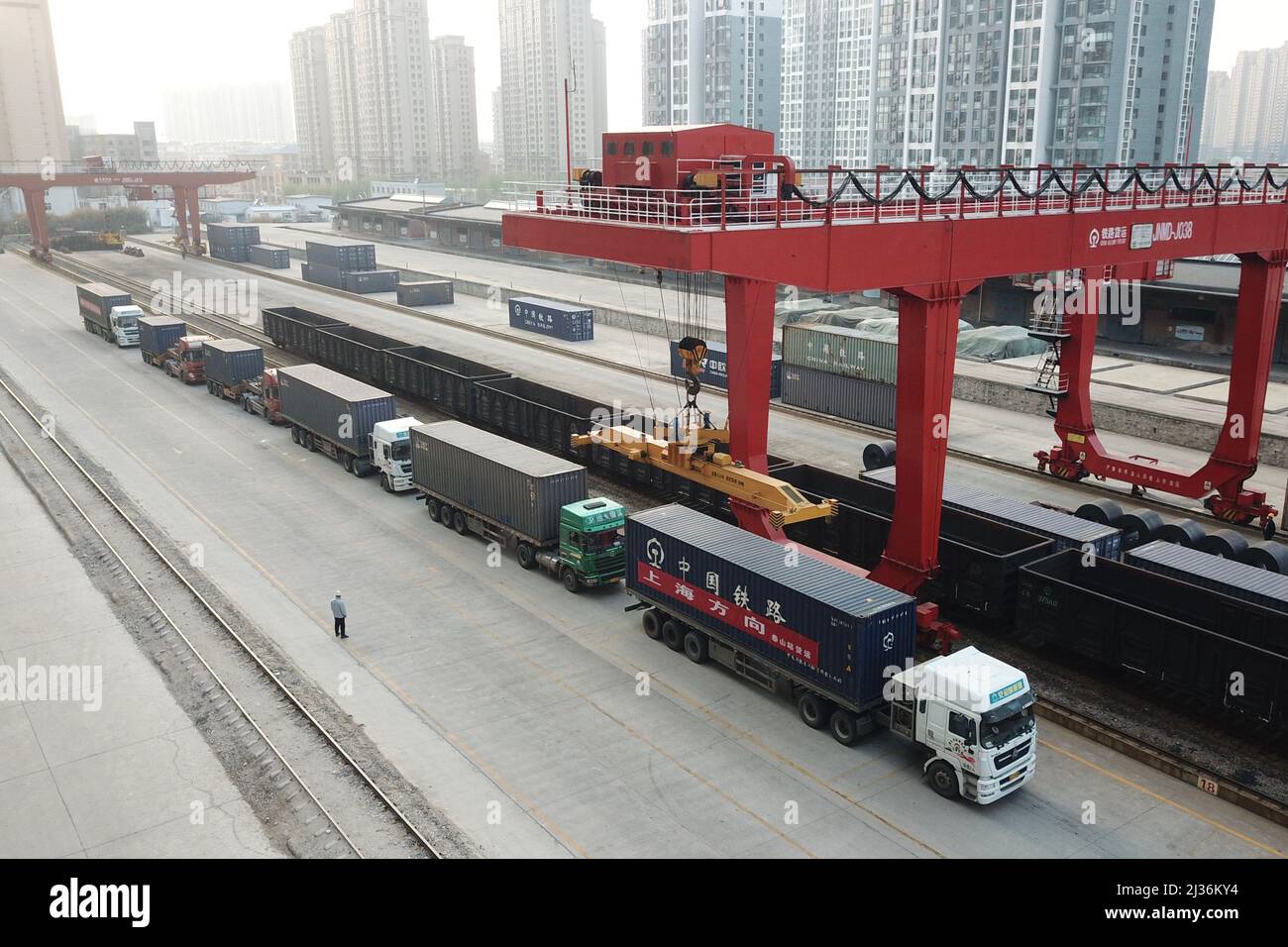TAI'AN, CHINA - APRIL 5, 2022 - Cranes load containers filled with milk ...