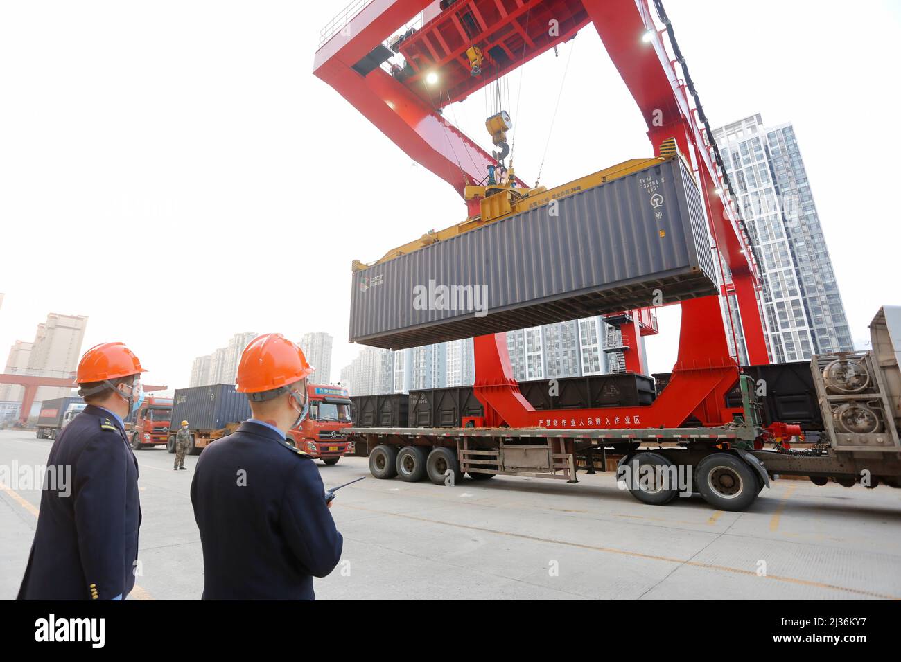 TAI'AN, CHINA - APRIL 5, 2022 - Cranes load containers filled with milk ...