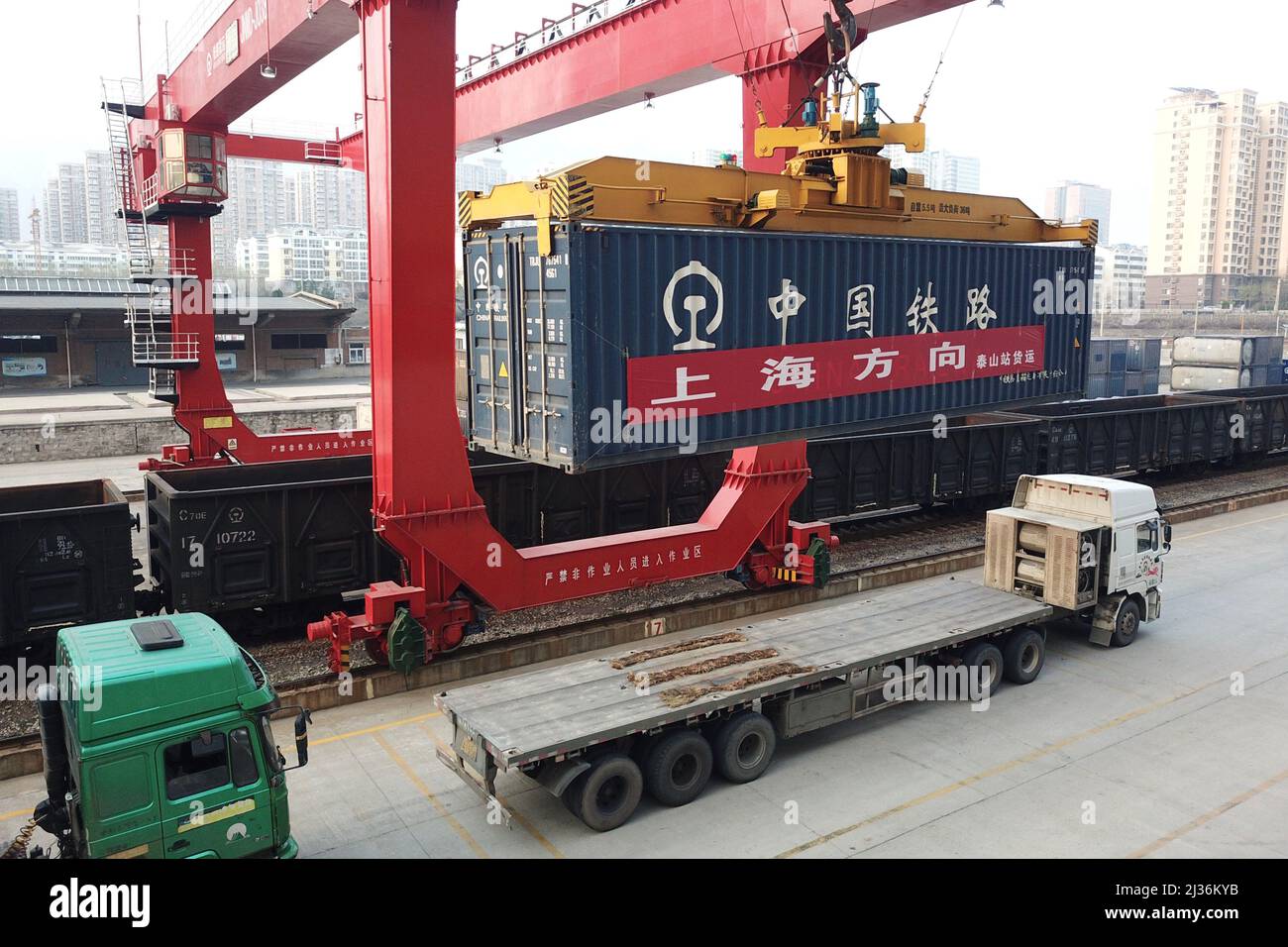 TAI'AN, CHINA - APRIL 5, 2022 - Cranes load containers filled with milk ...