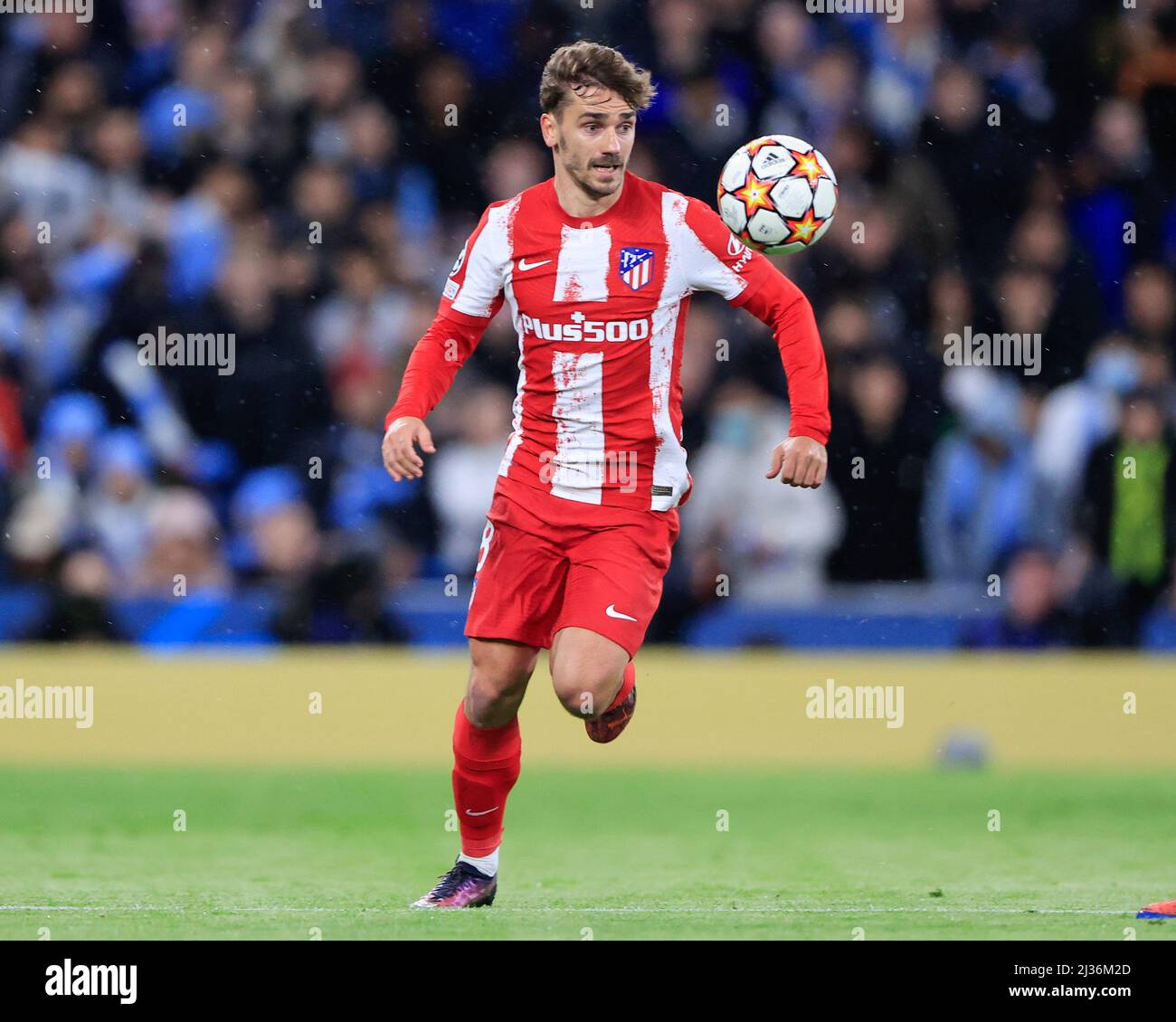 Antoine Griezmann #8 of Athletico Madrid runs with the ball Stock Photo ...
