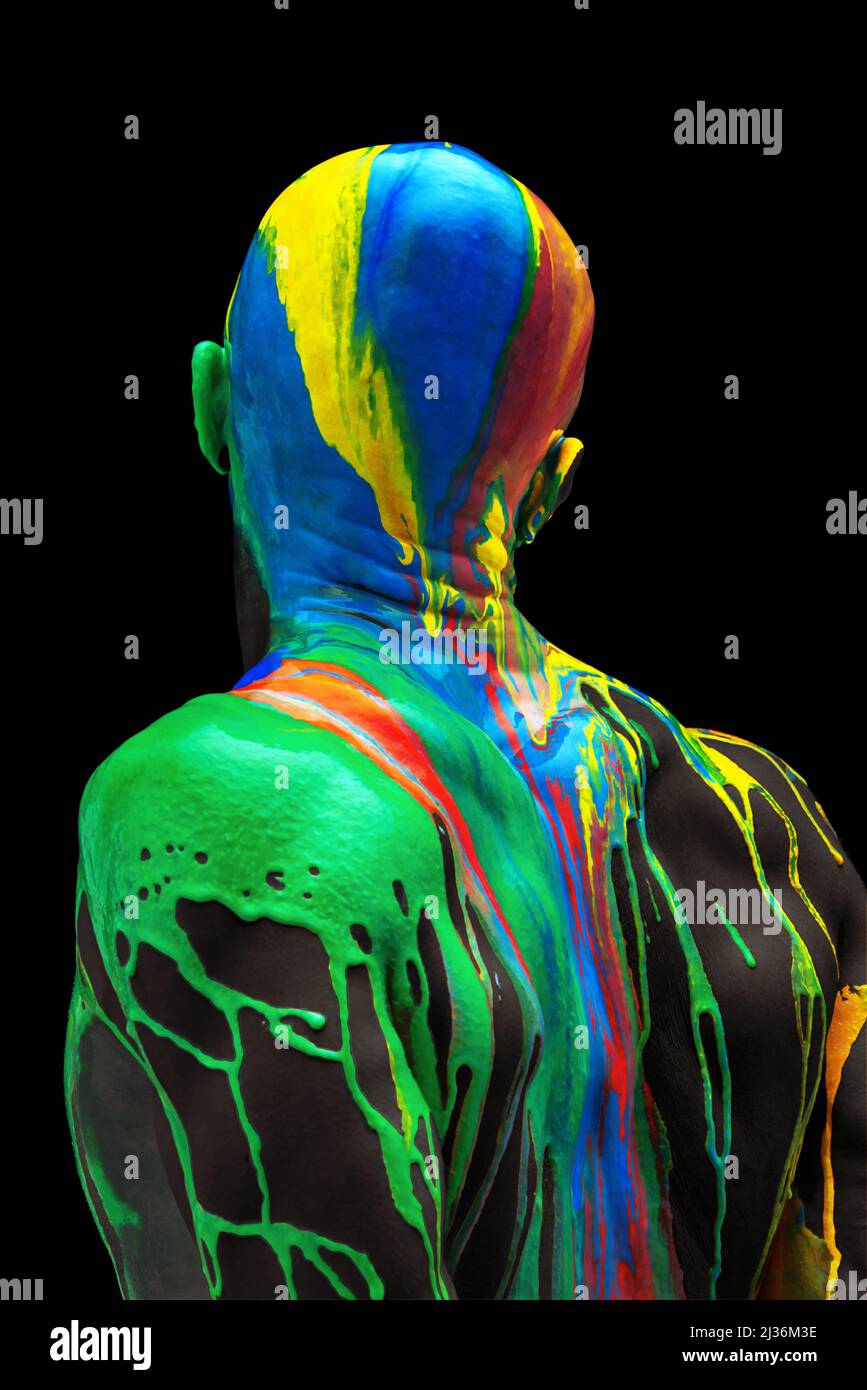 Rear view. Abstract art on human body. Multi-colored paints, dyes flow ...